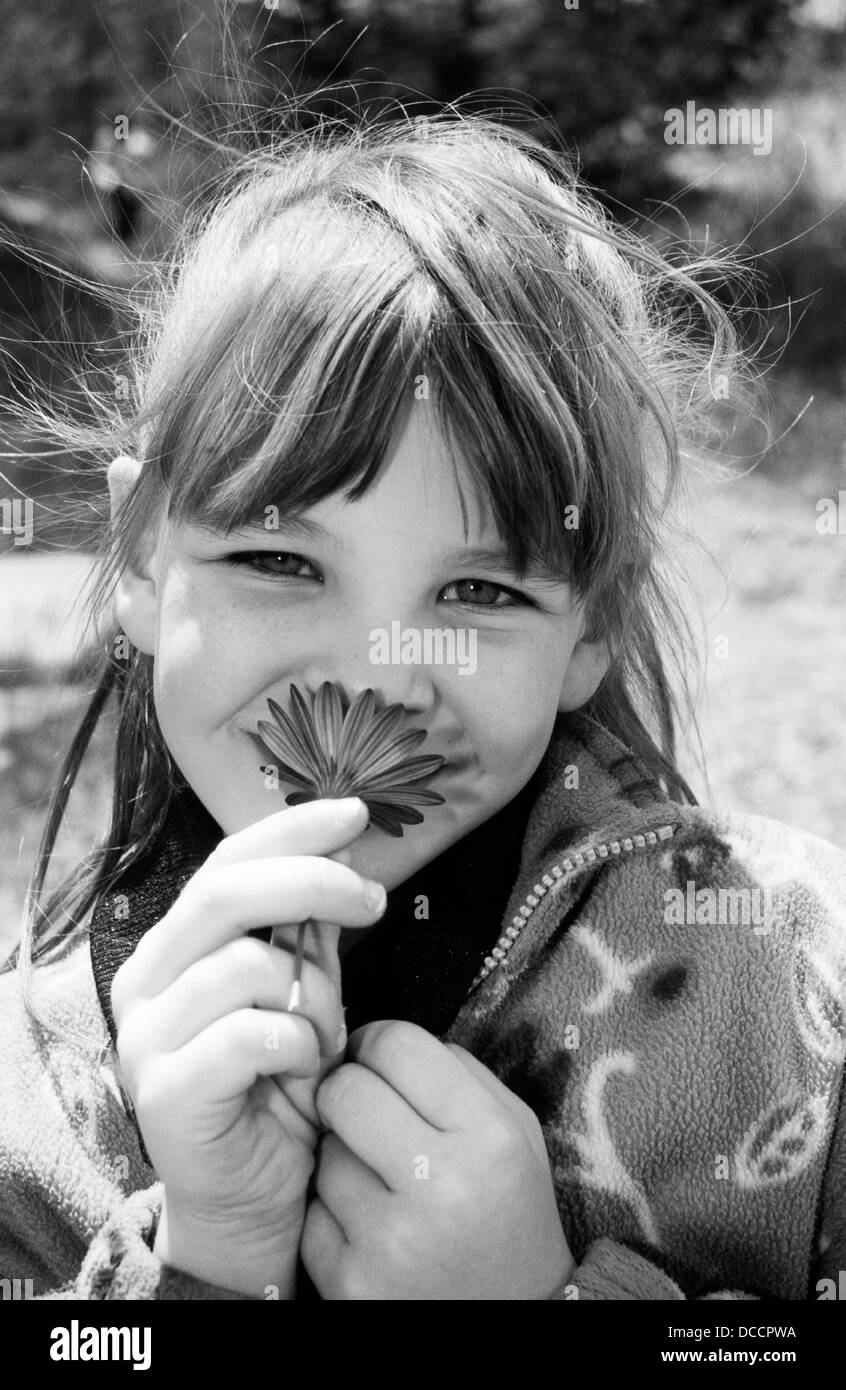 Smelling flower Black and White Stock Photos & Images - Alamy