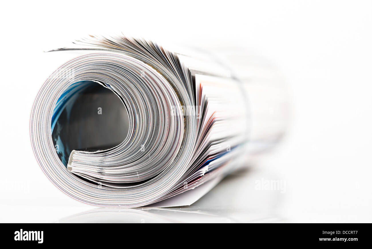 magazine roll on white background Stock Photo - Alamy