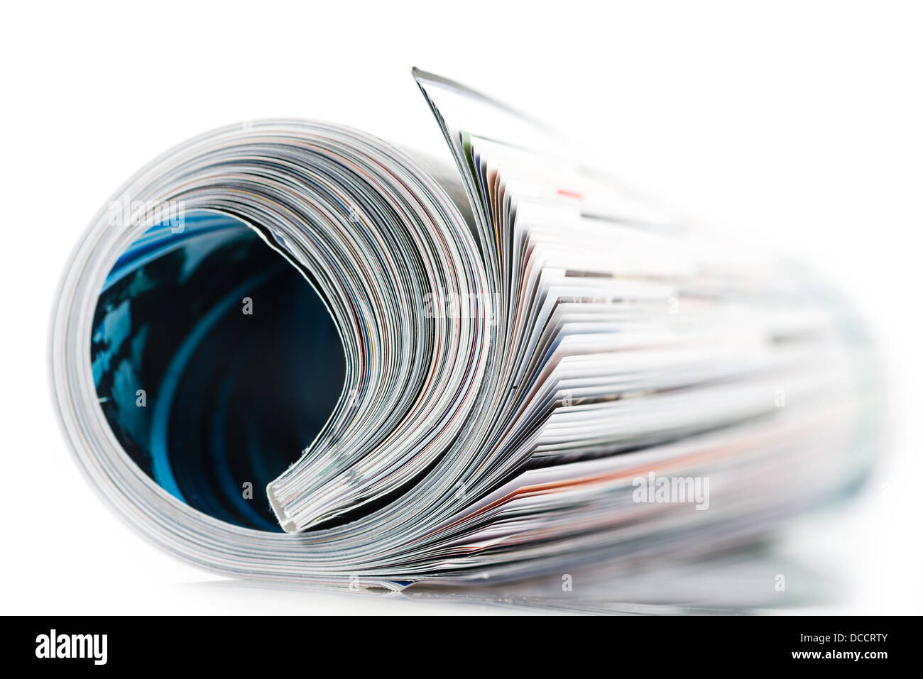 magazine roll on white background Stock Photo - Alamy