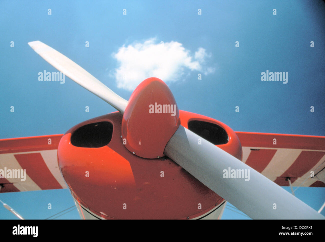 Small plane nose with propeller and cloud Stock Photo - Alamy