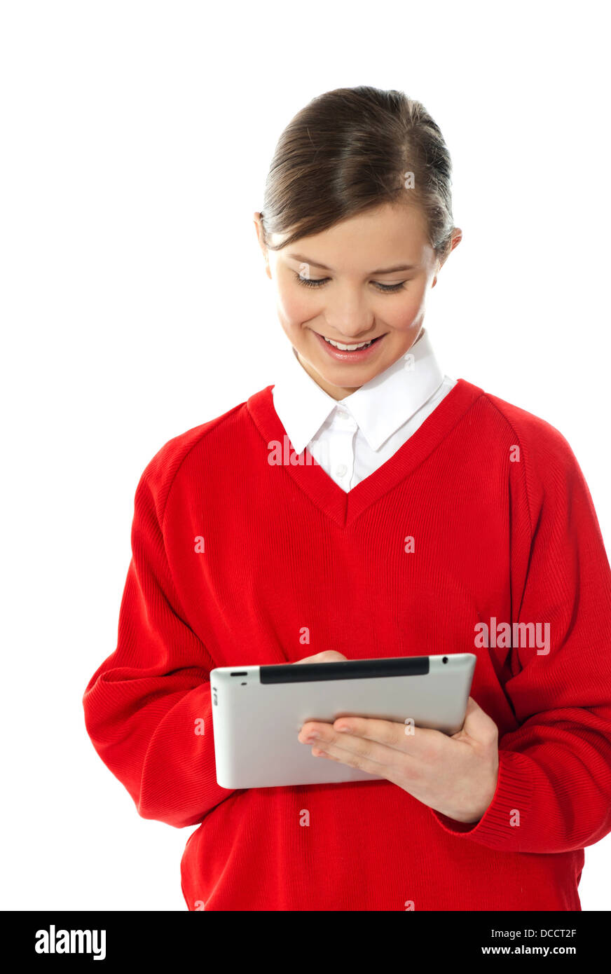 Happy young girl using tablet pc isolated over white background Stock ...
