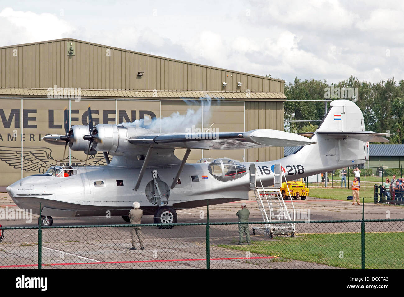 Smoke billows from the engines as this airworthy Catalina flying boat ...