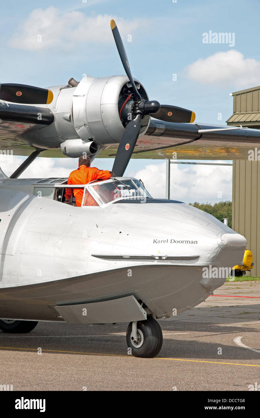 Pilot peers from the cockpit after an engine problem on the Catalina ...