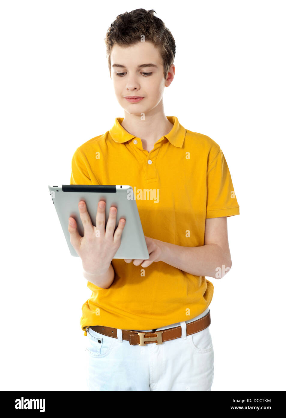 Portrait of a cute boy using a portable device computer against white ...