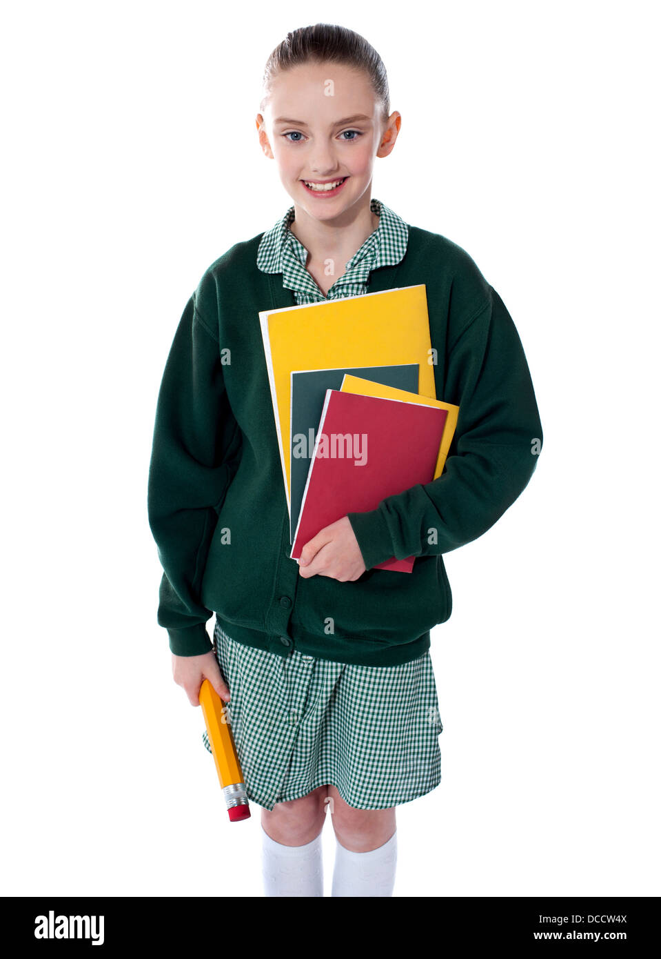 School girl standing with notebooks and pencil Stock Photo - Alamy
