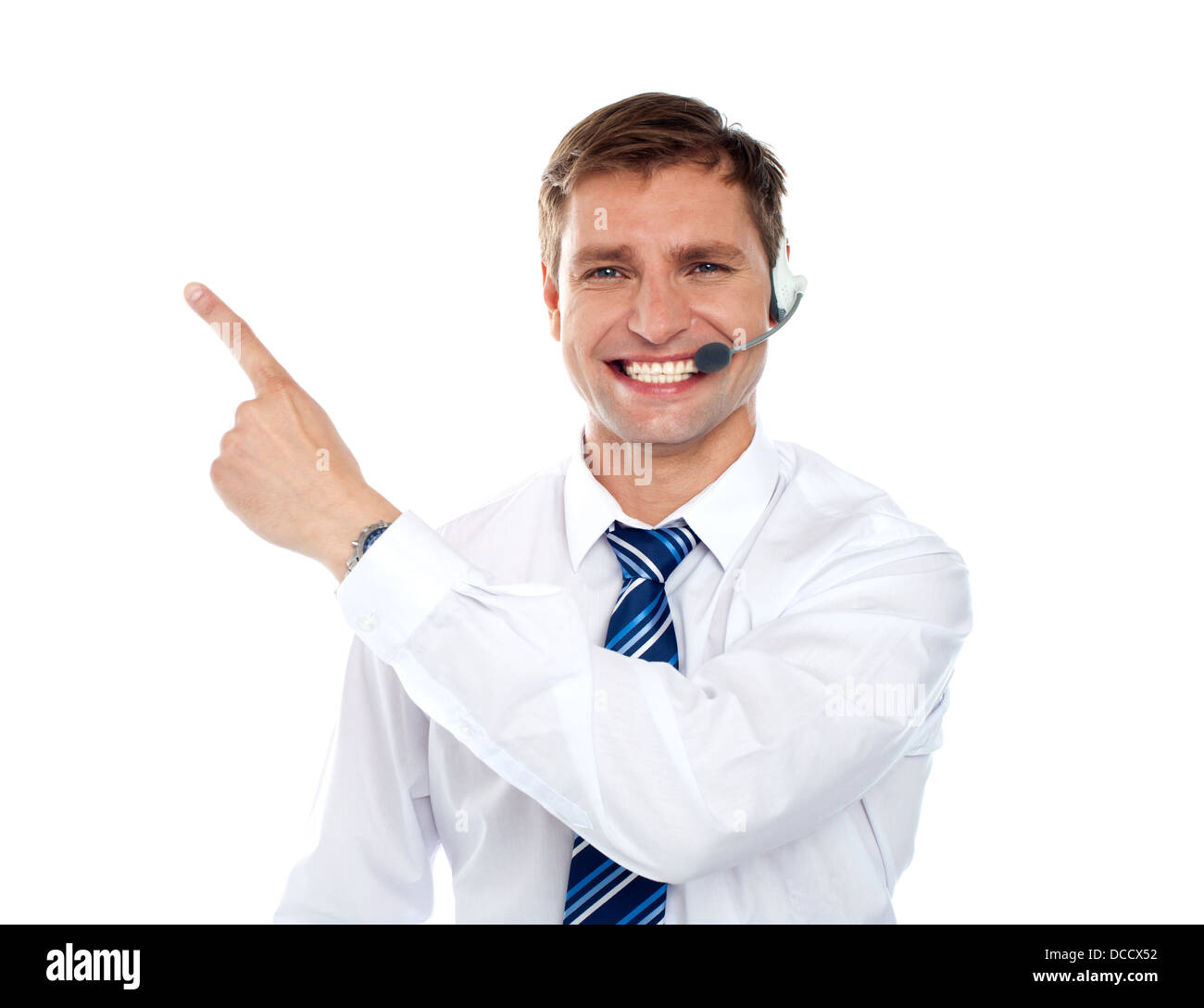 Customer service agent with headsets pointing towards copy space area ...