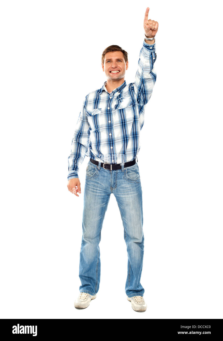 Happy guy pointing up towards copy space area Stock Photo - Alamy