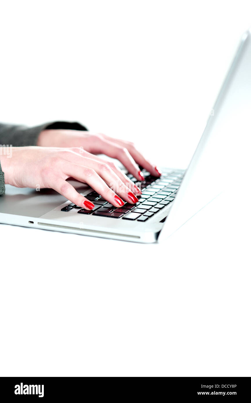 Female hands operating laptop. Cropped image. All on white background ...