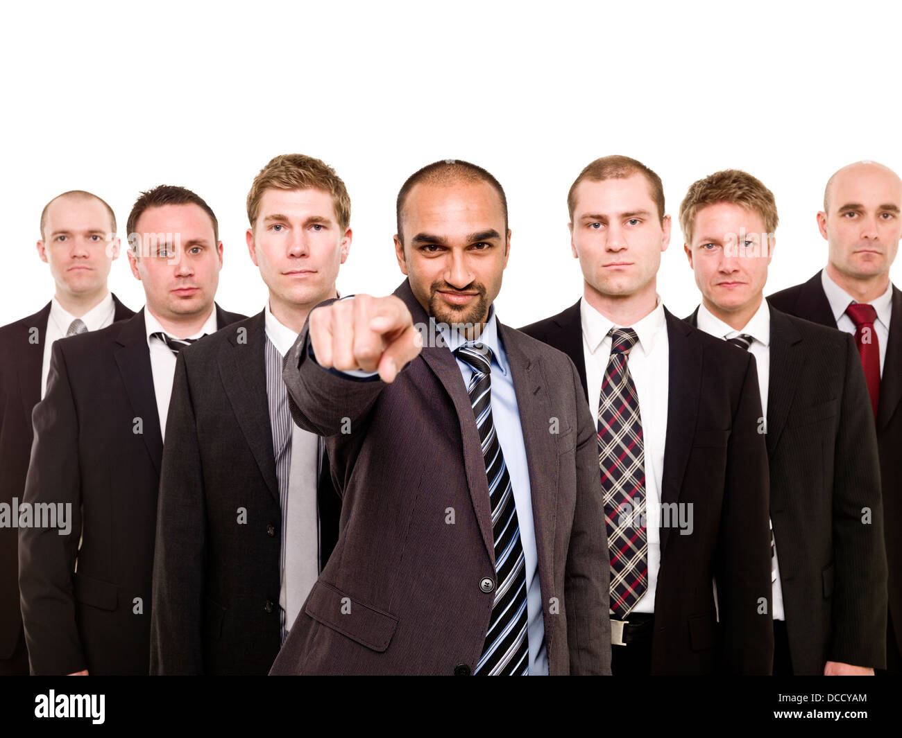 Pointing man in front of his team Stock Photo - Alamy