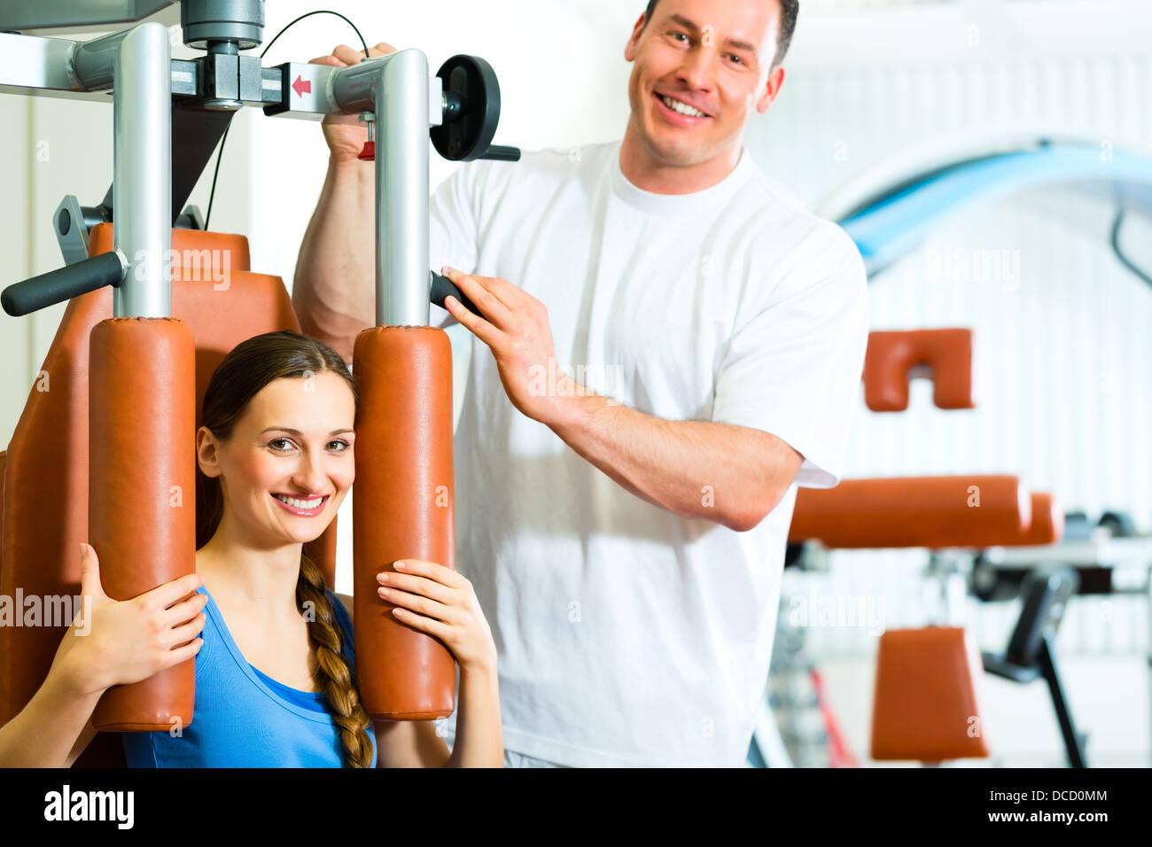 Patient at the physiotherapy making physical exercises with her ...