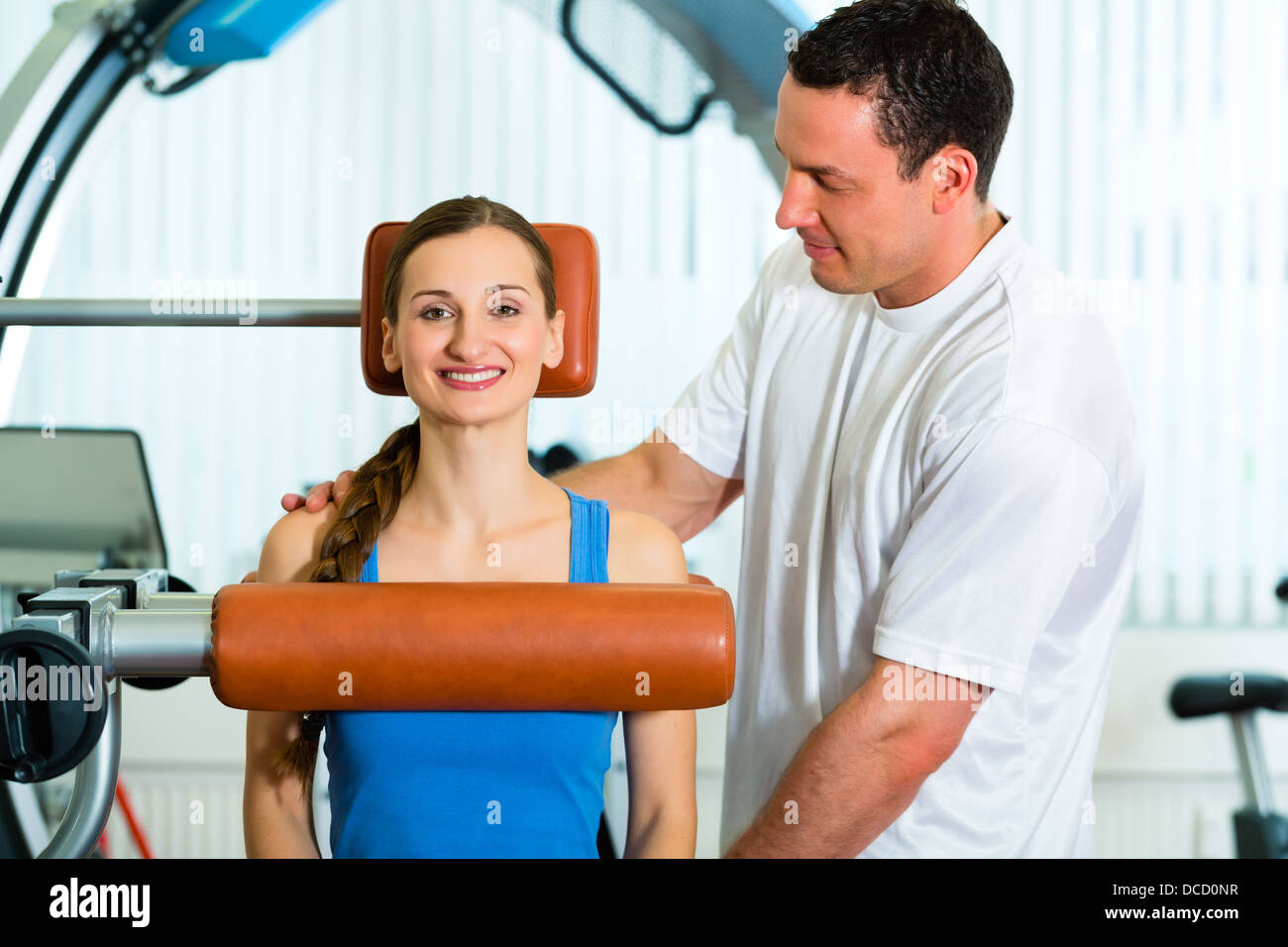 Patient at the physiotherapy making physical exercises with her ...