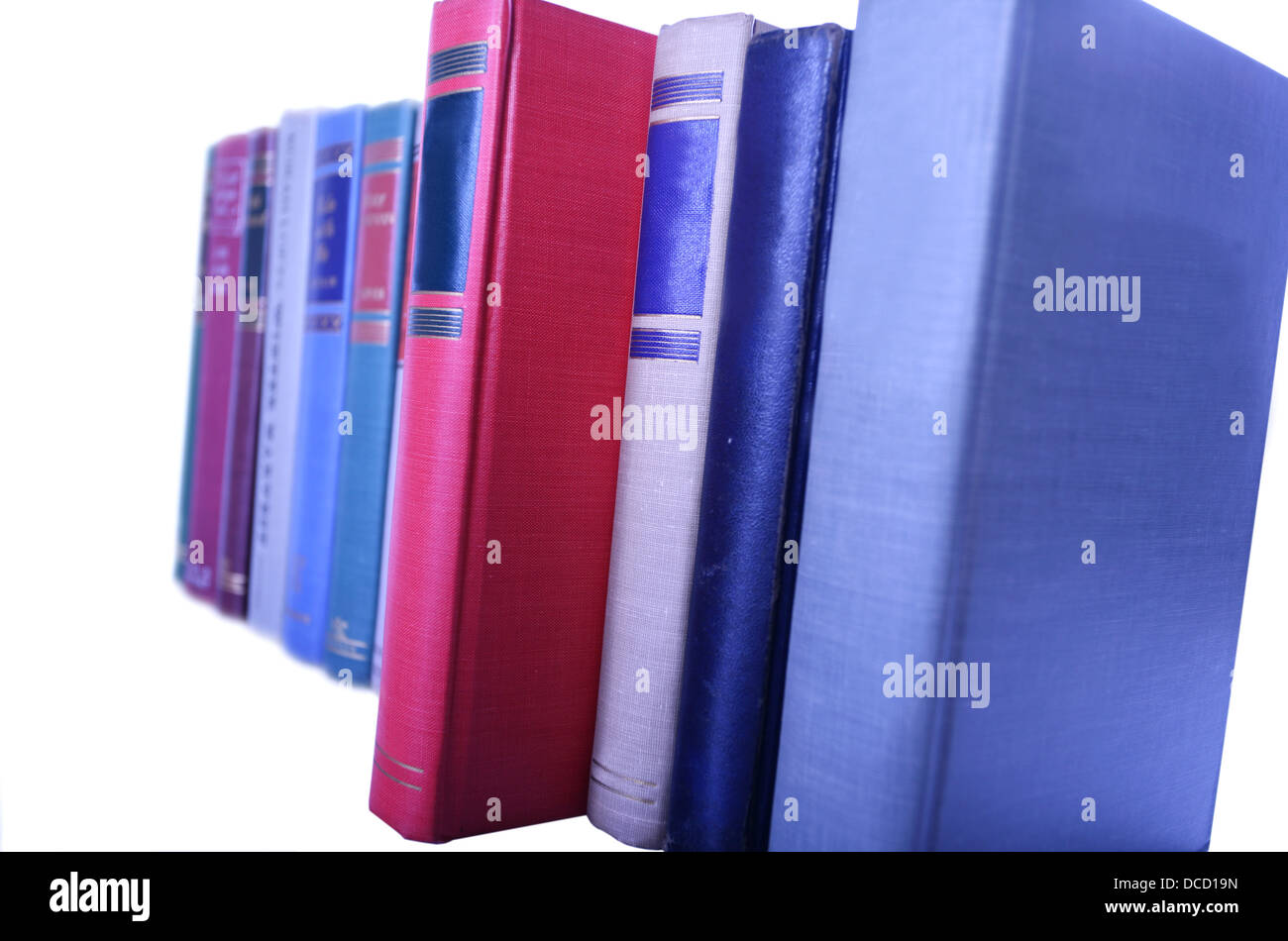 Row of books lined up in row Stock Photo - Alamy
