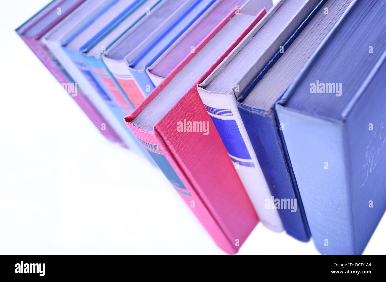 Row of books lined up in row Stock Photo - Alamy