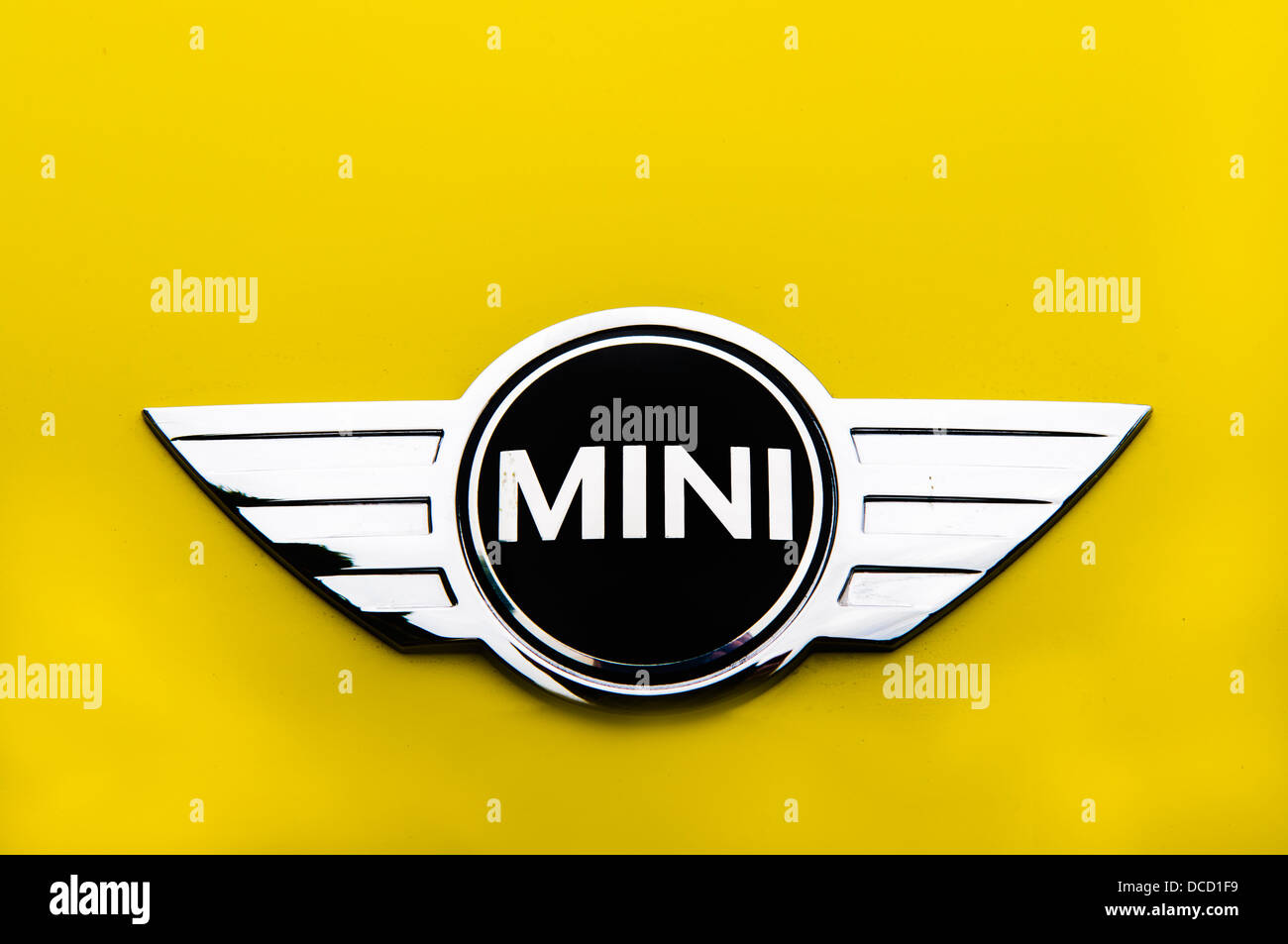 Mini badge on a yellow car Stock Photo - Alamy