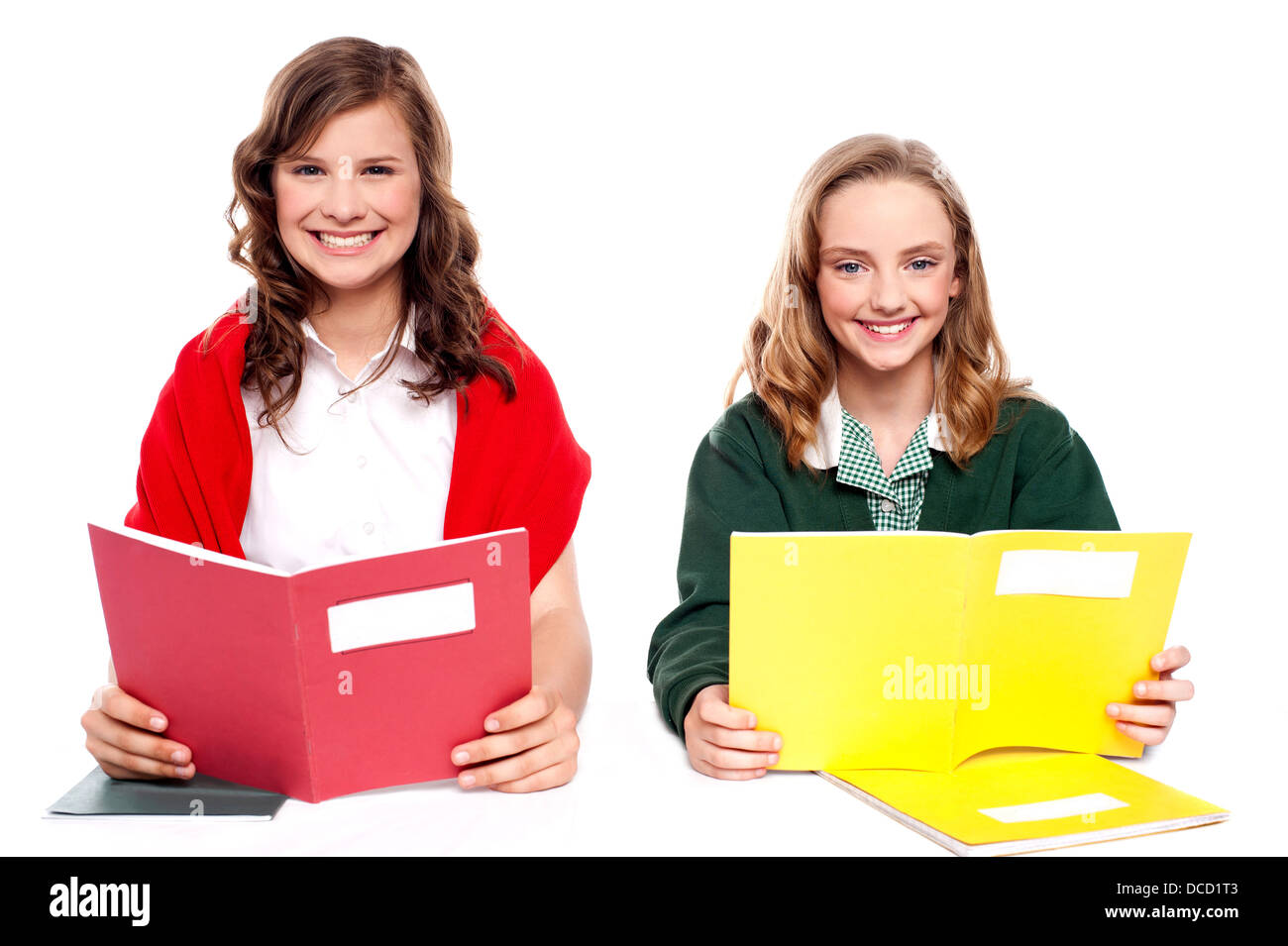 Smiling girl learning from school books isolated over white Stock Photo ...