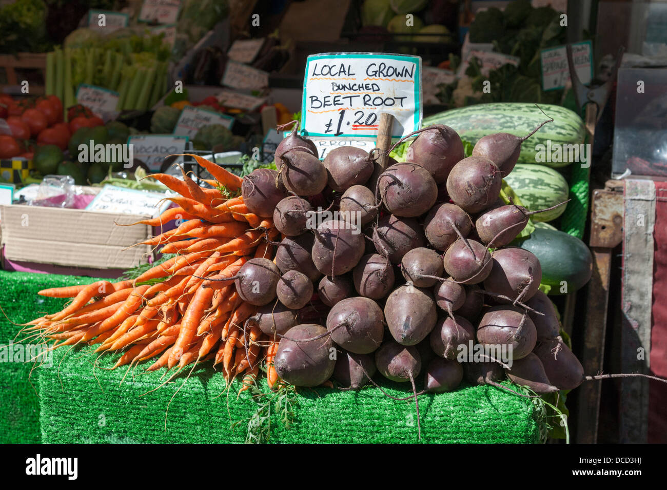 Beetroot and carrots for sale on a UK market stall Stock Photo - Alamy