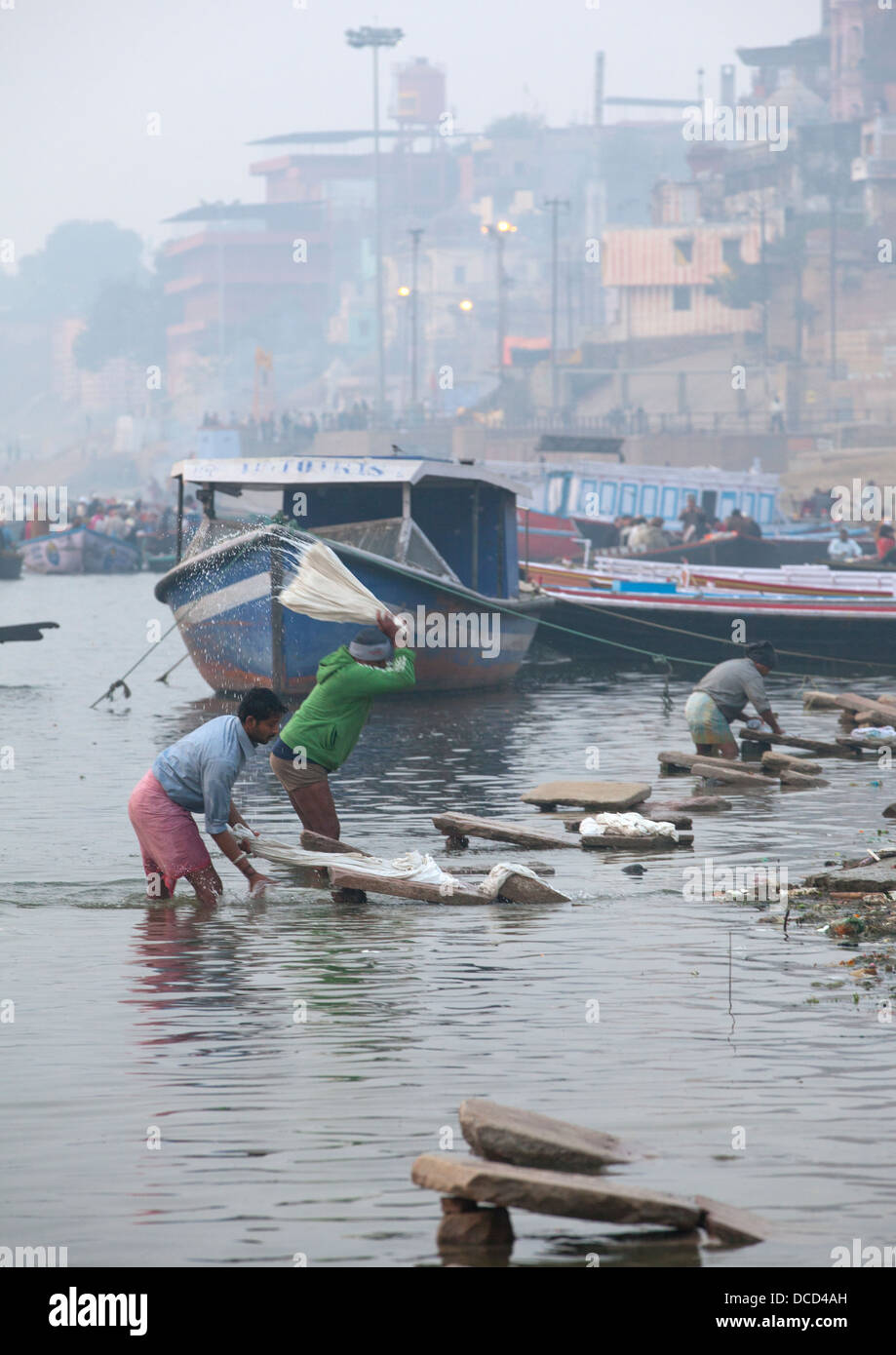 Men Washing Clothes In The Ganges River, Varanasi, India Stock Photo ...