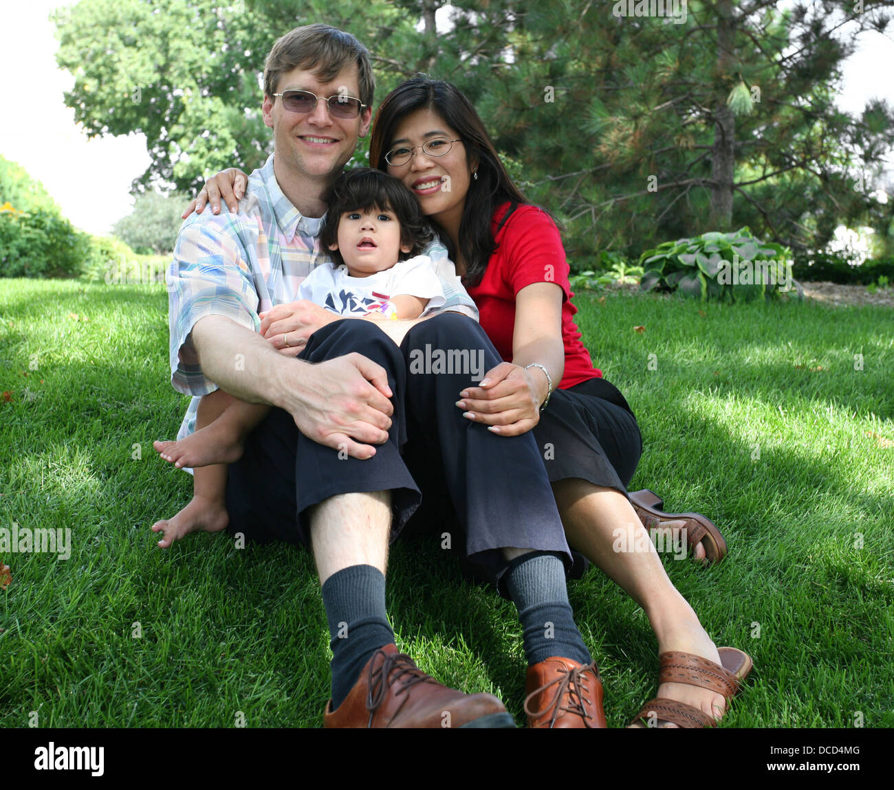 Family of three Stock Photo - Alamy