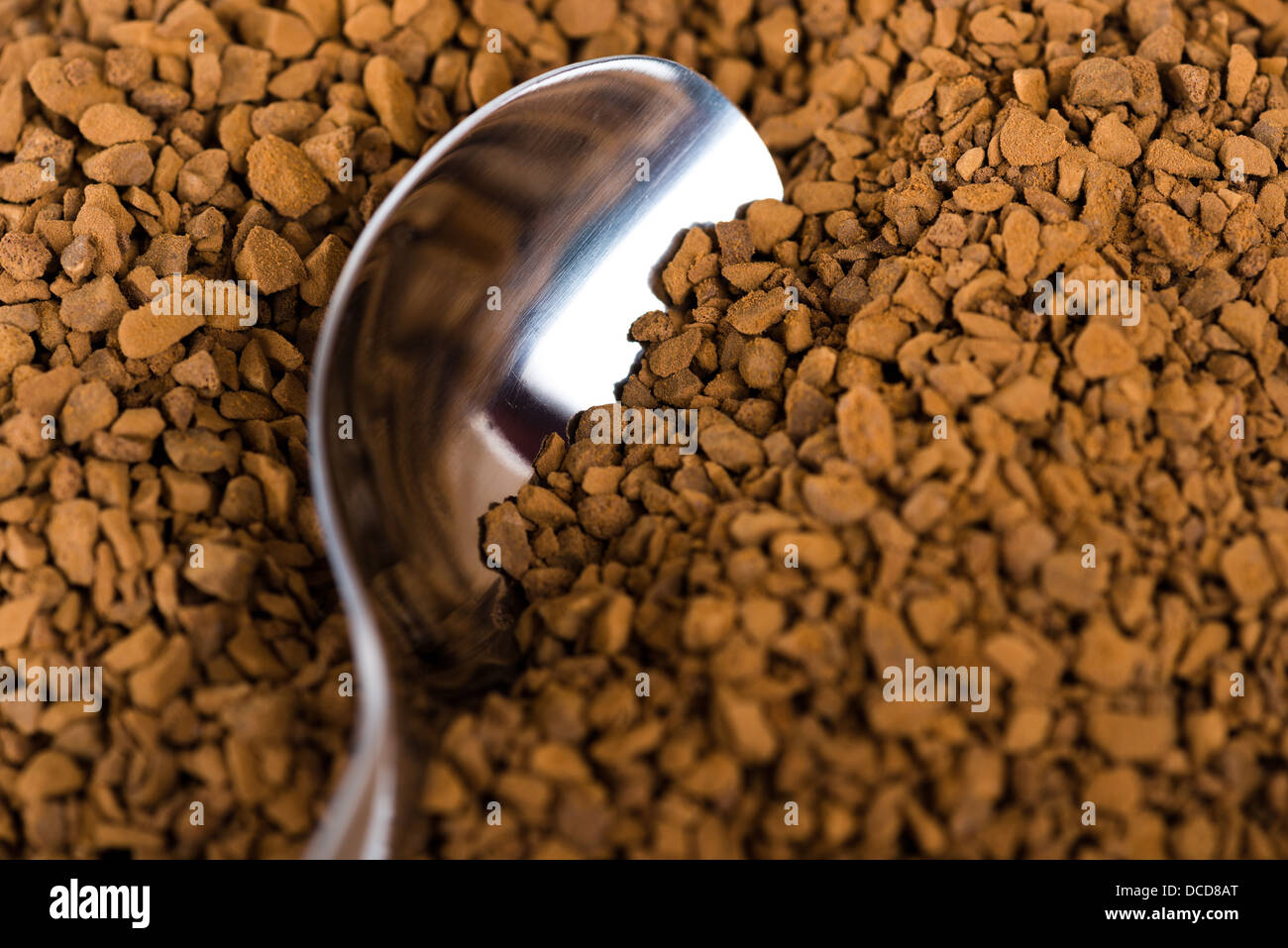 Spoon of coffee at coffee background Stock Photo - Alamy