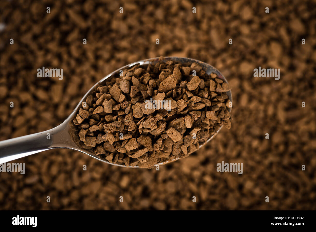 Spoon of coffee at coffe background Stock Photo - Alamy