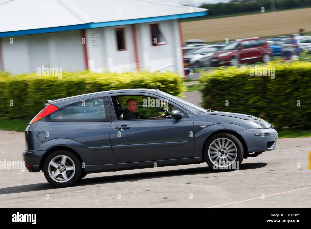 A car taking part in an AutoSolo at Castle Combe Circuit Stock Photo ...