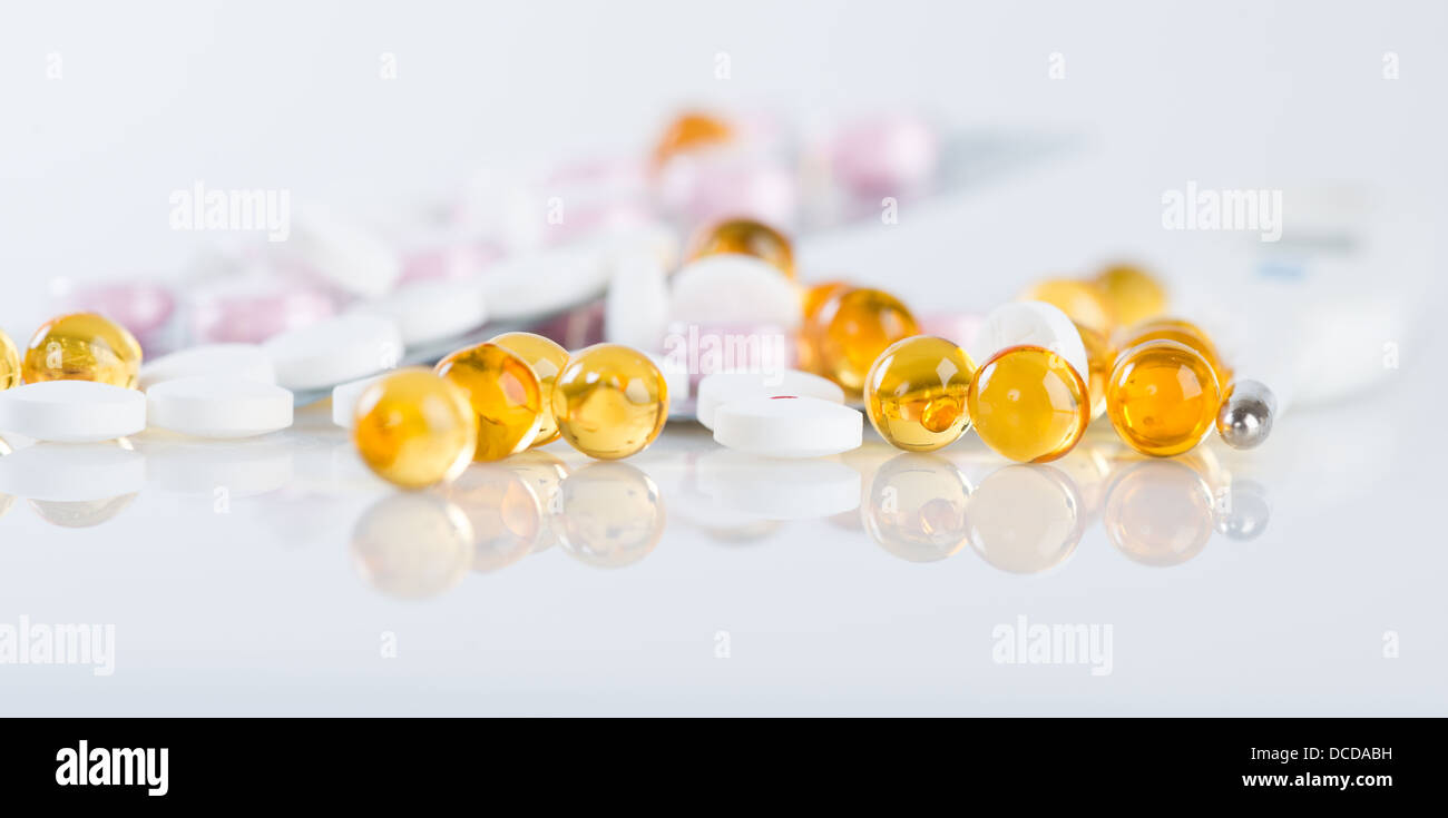Colorful tablets with capsules Stock Photo - Alamy