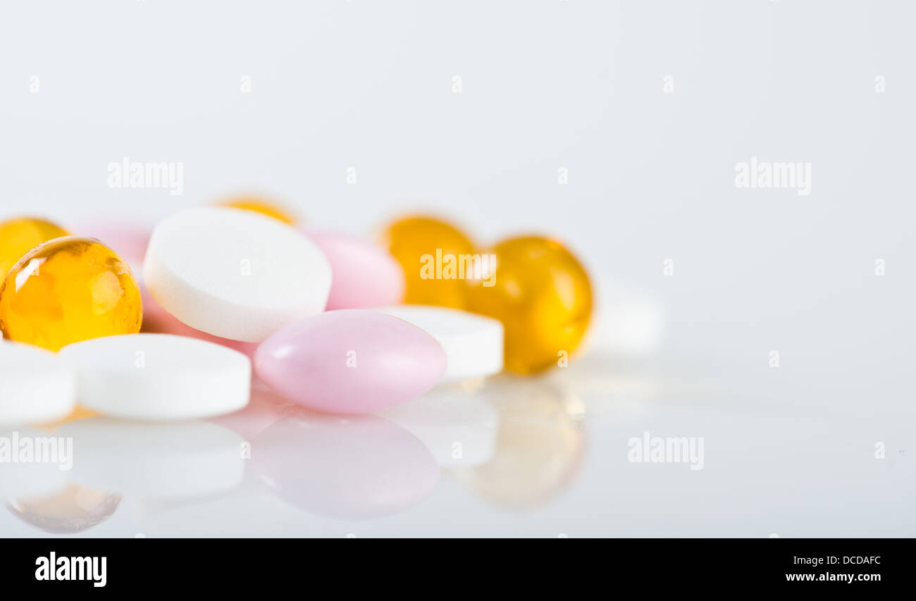 Colorful tablets with capsules Stock Photo - Alamy