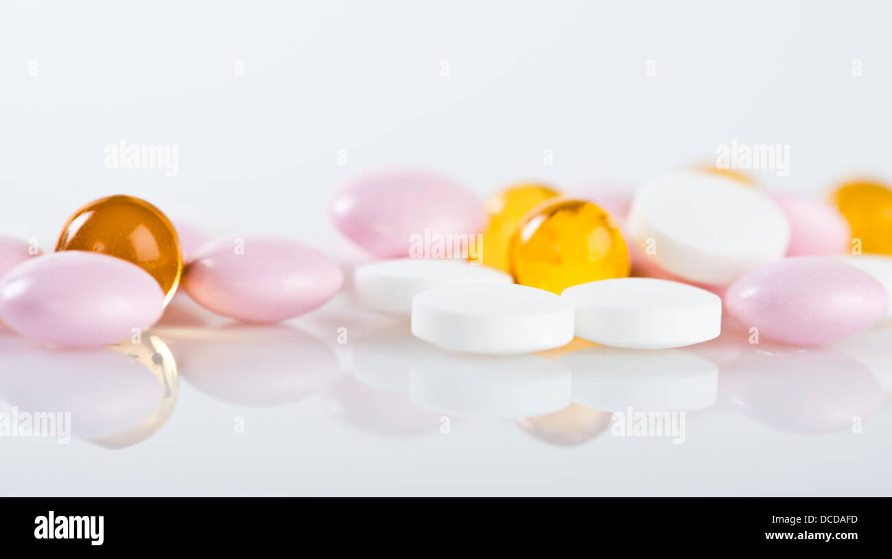 Colorful tablets with capsules Stock Photo - Alamy