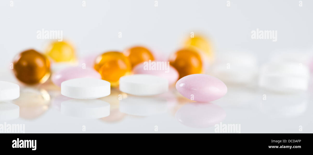 Colorful tablets with capsules Stock Photo - Alamy