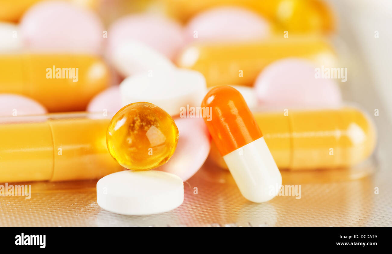 Colorful tablets with capsules Stock Photo - Alamy
