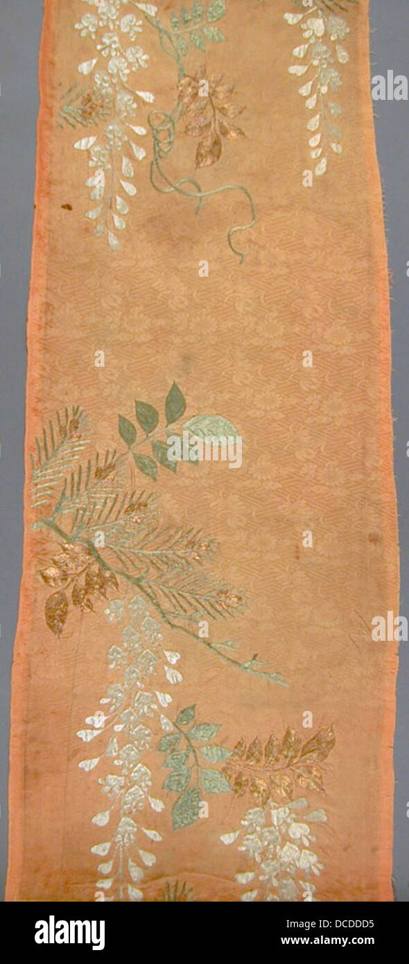 This fragment of a Japanese kosode, featuring pine and wisteria designs ...