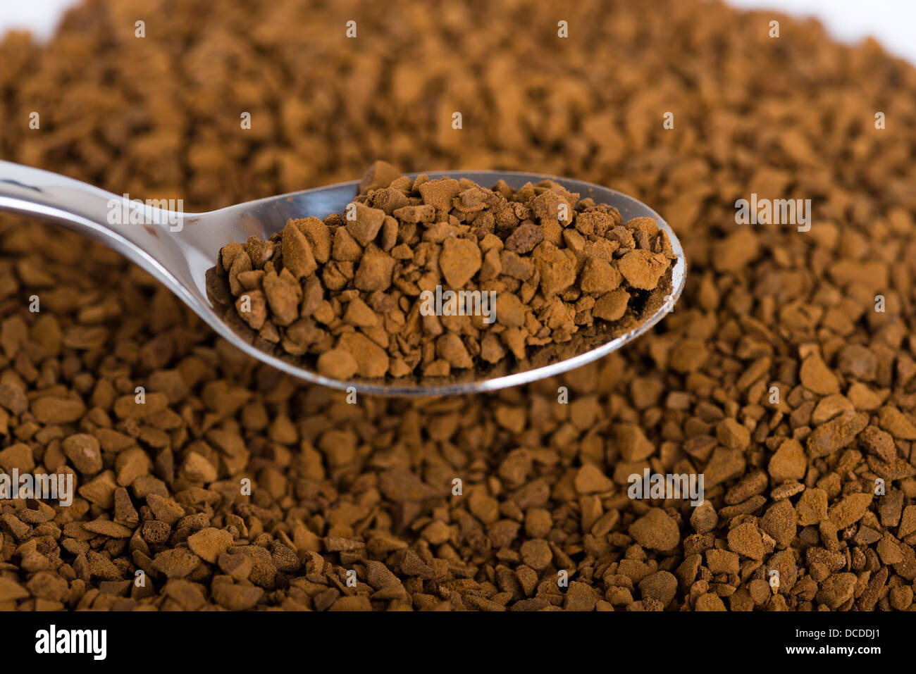 Spoon of coffee at coffe background Stock Photo - Alamy
