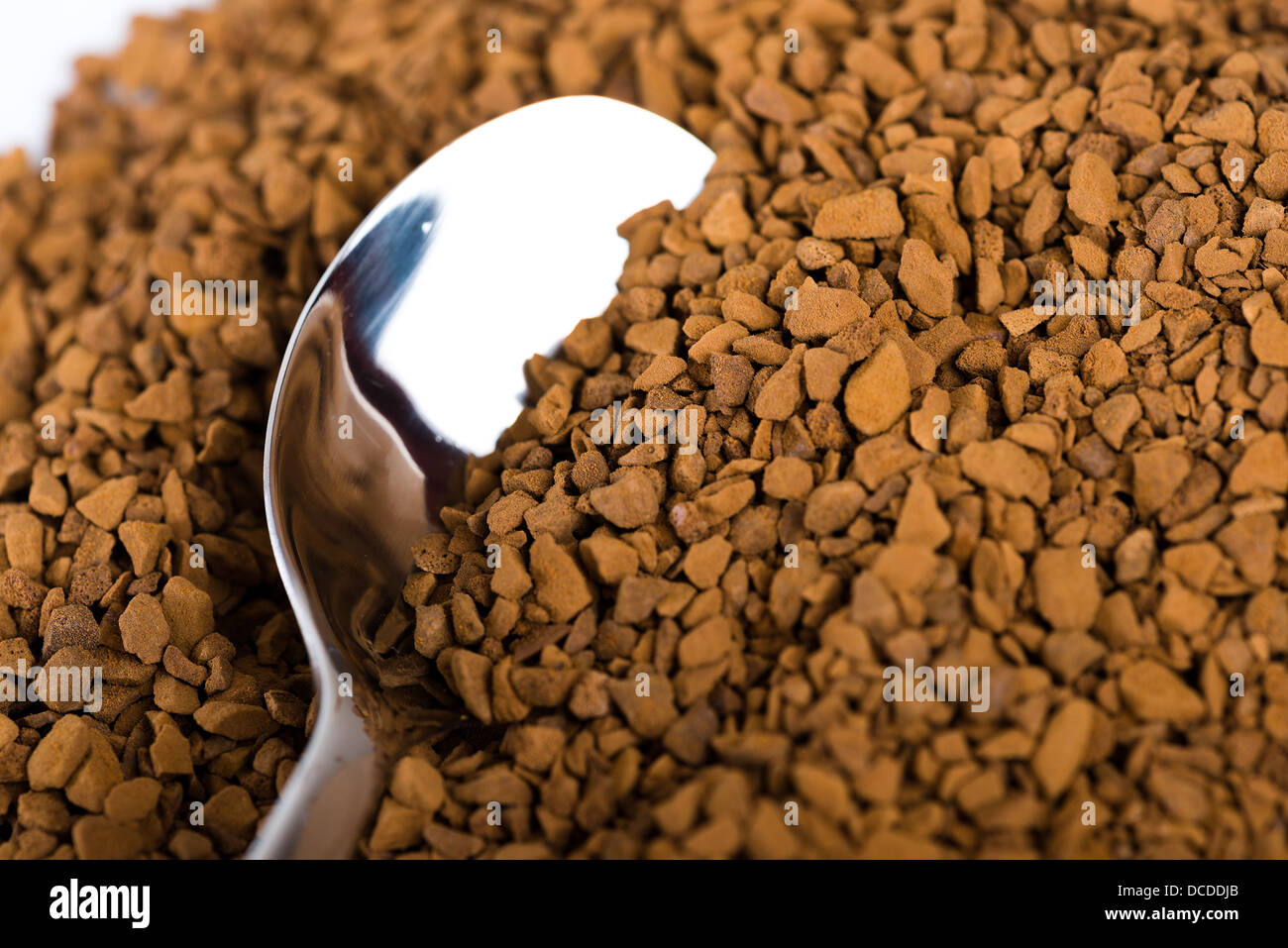 Spoon of coffee at coffe background Stock Photo - Alamy