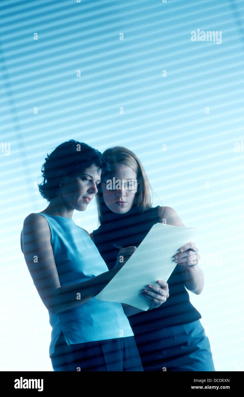 Two female office workers Stock Photo - Alamy