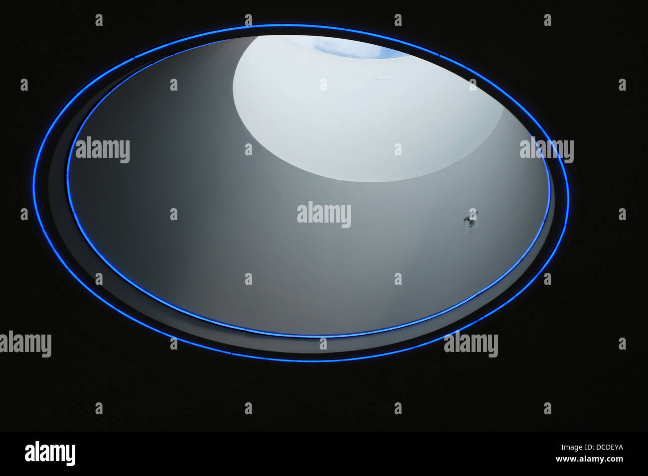 A round window with blue light in the ceiling of a building in Winnipeg ...