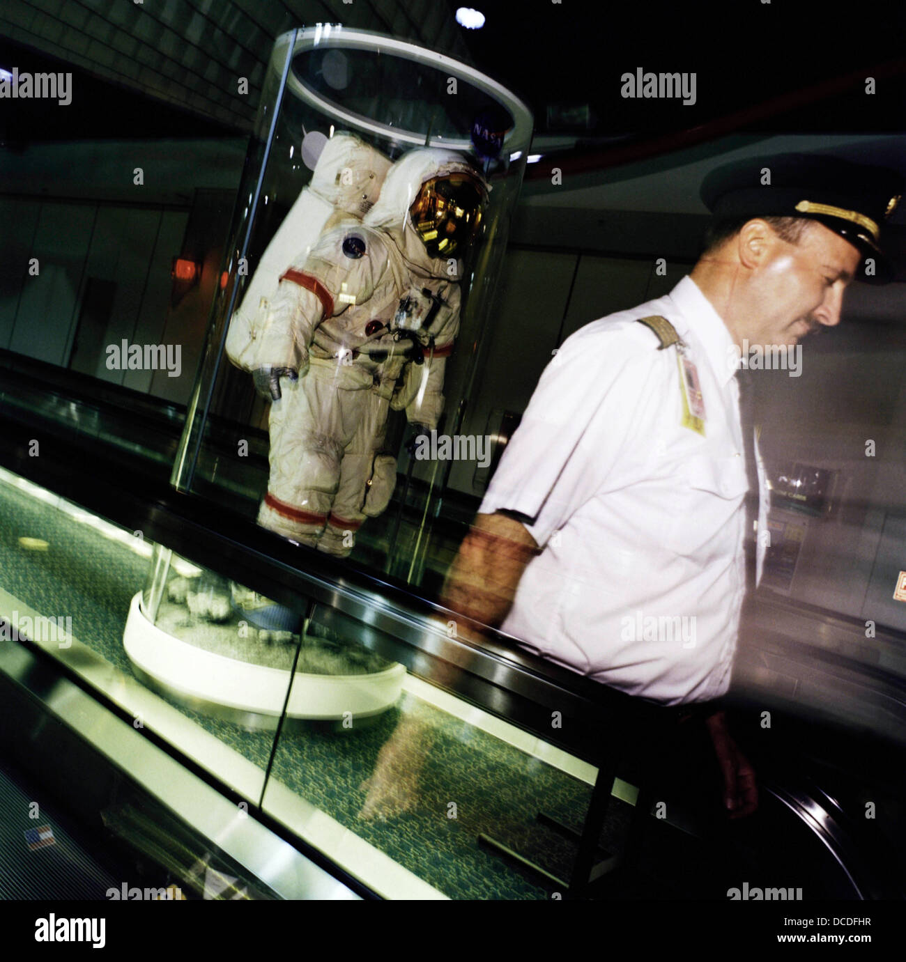 A moon-walking NASA astronaut model stands in the middle of two ...