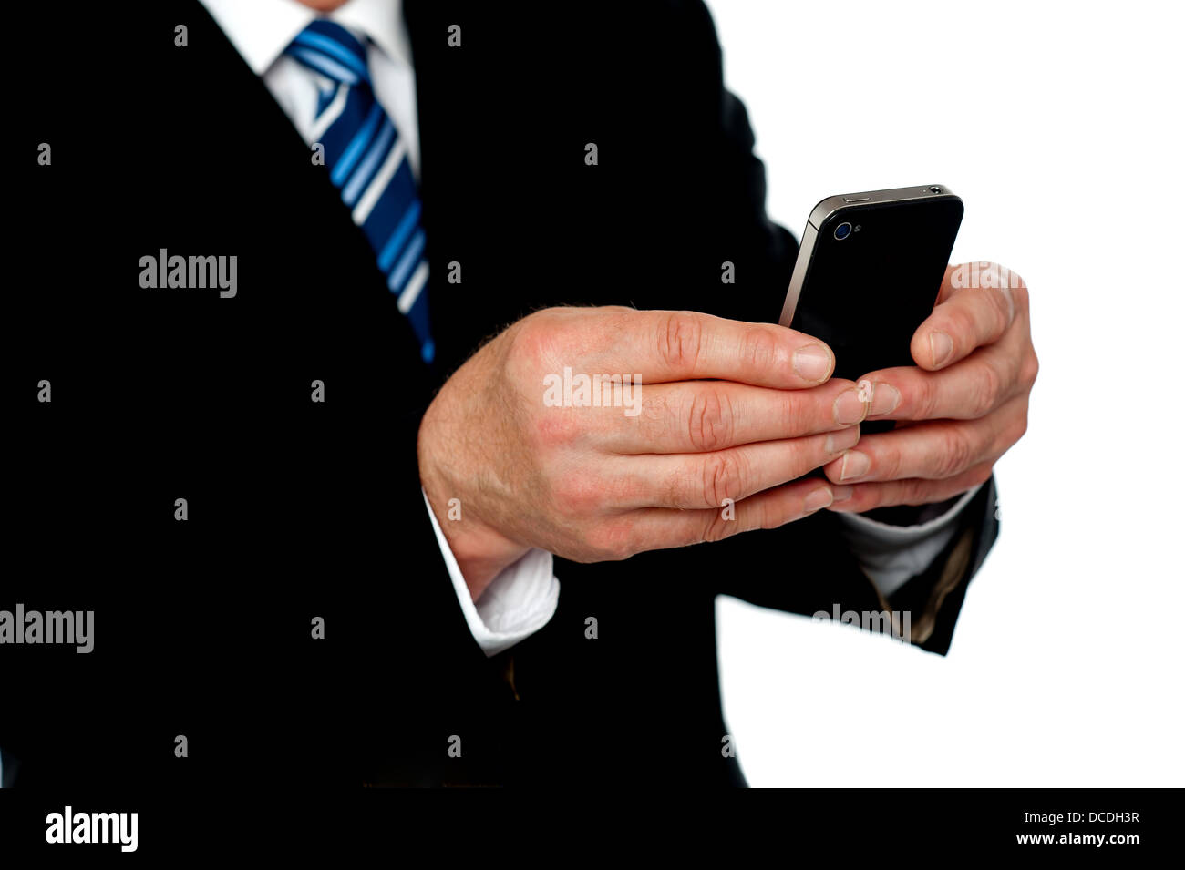 Cropped image of a man sending message from his phone, cropped image ...