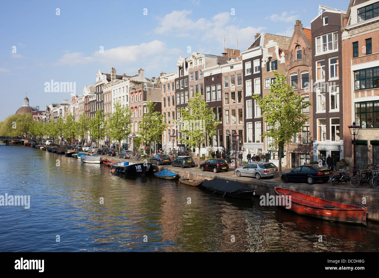 Historic row houses by the Singel canal in the city of Amsterdam ...