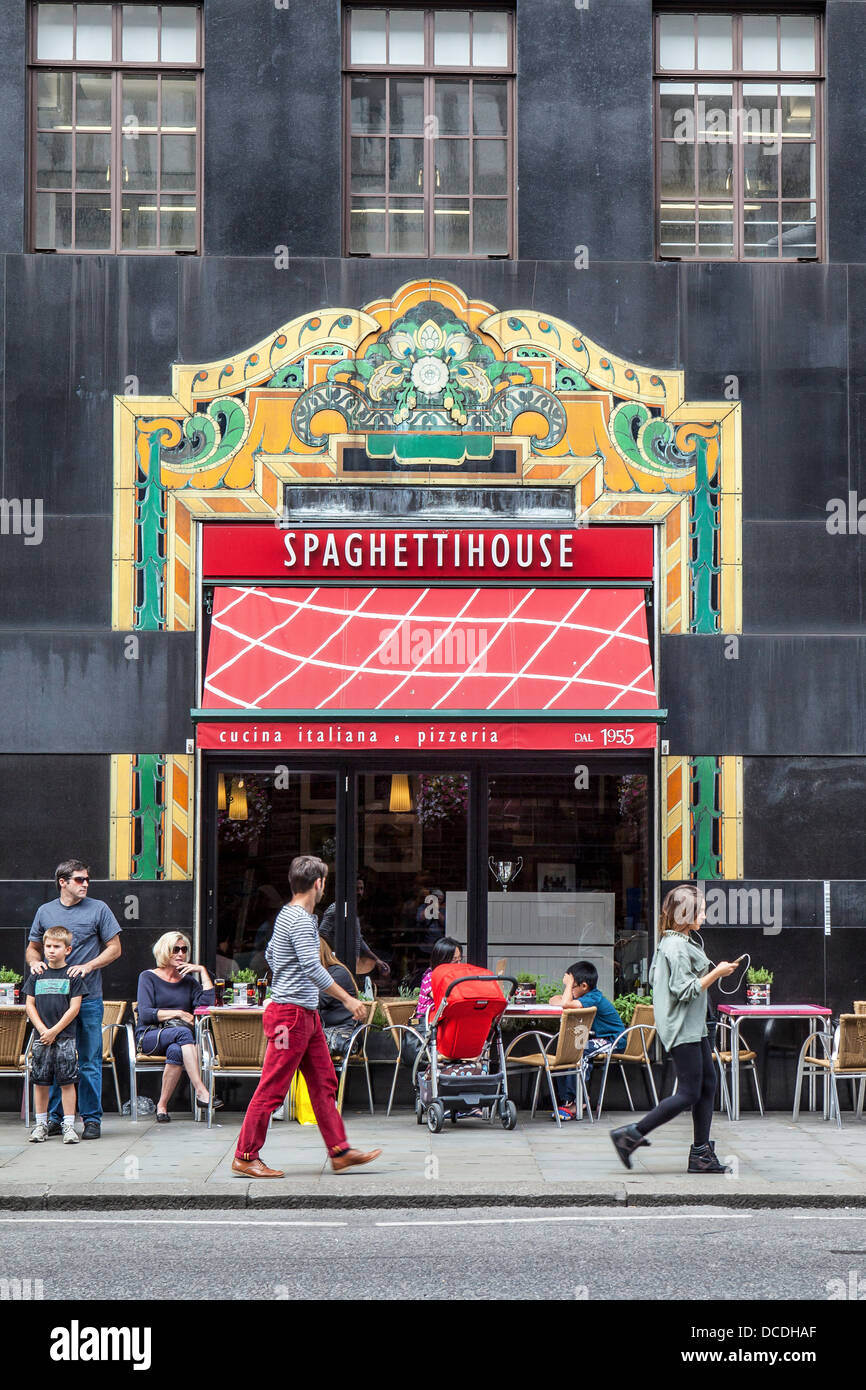People walk past decorative entrance of SpaghettiHouse restaurant ...