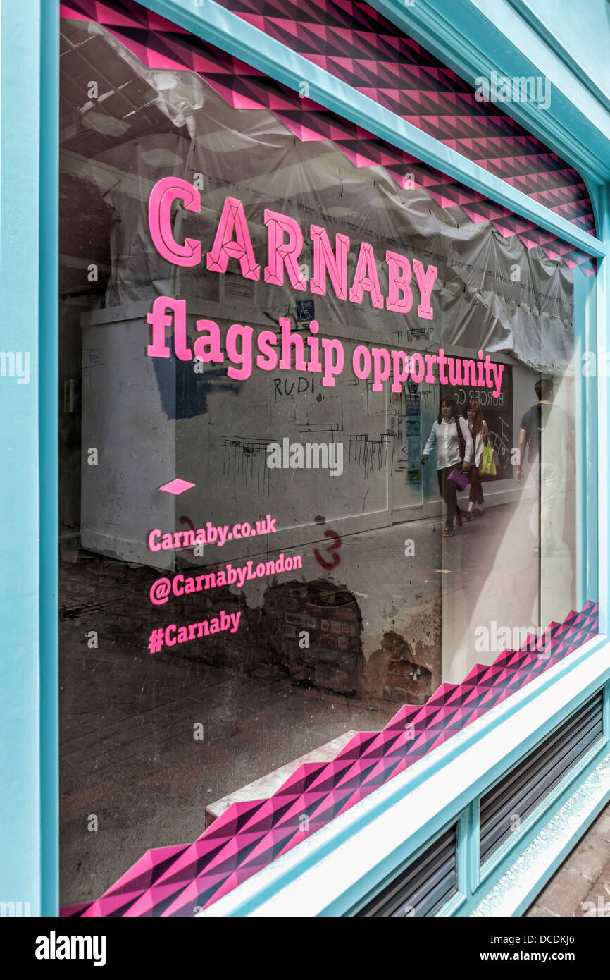Window of vacant shop in Carnaby street advertising opportunity Stock ...