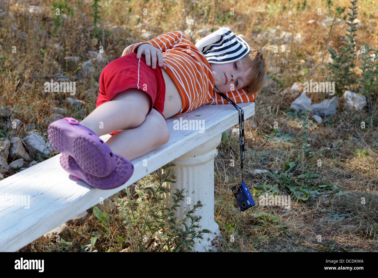 Child resting lying bench break camera hi-res stock photography and ...