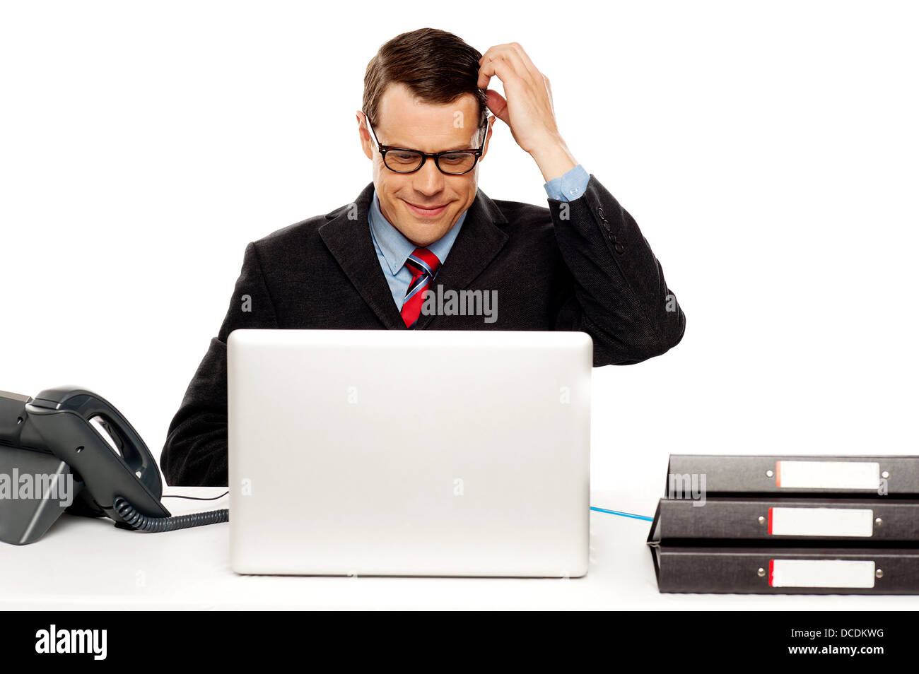 Confused male manager itching his head. Trying to understand business ...