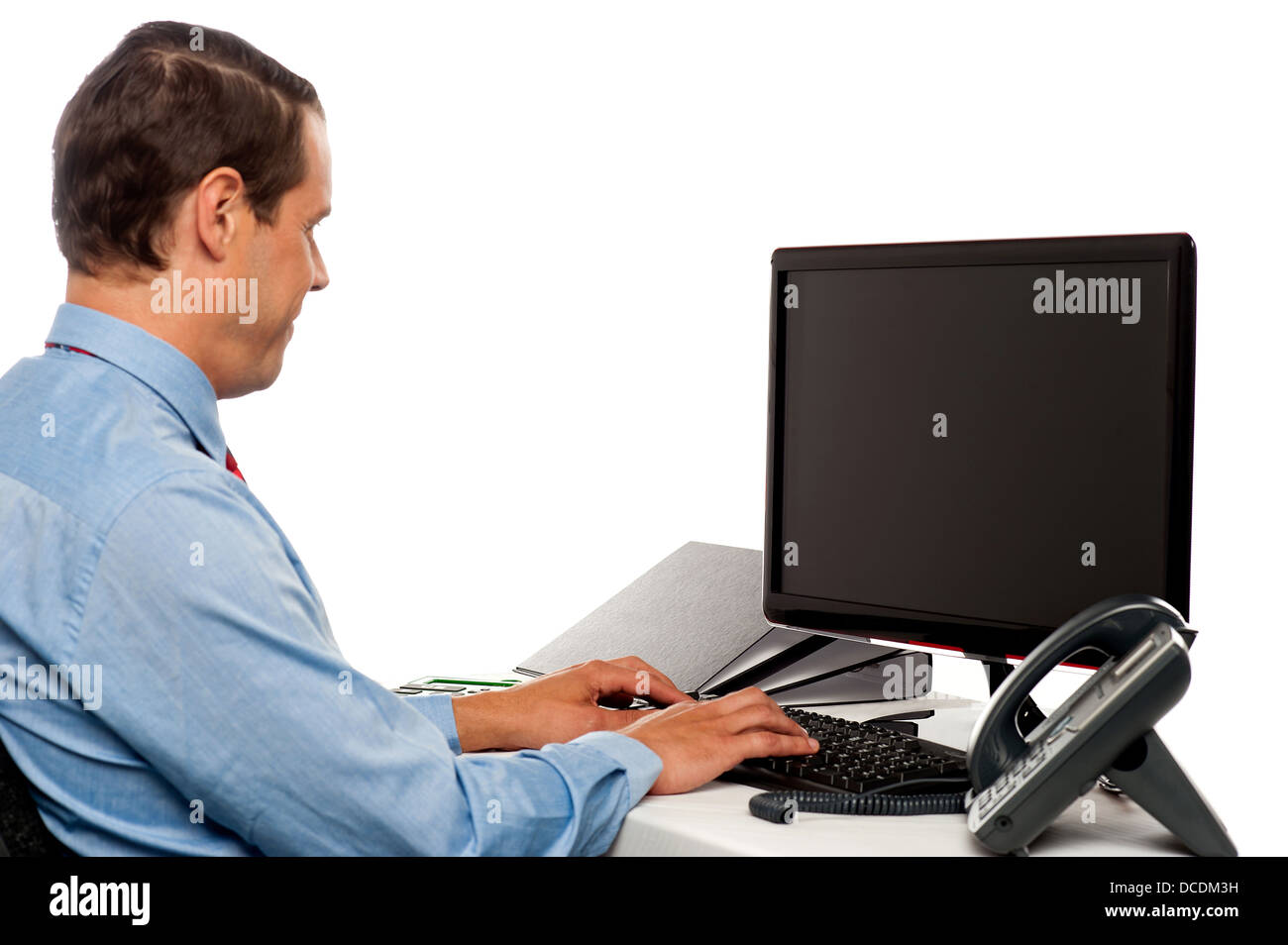 Side view male accountant working in office in front of computer screen ...