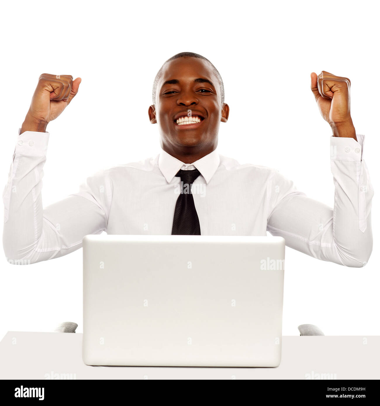 Victorious african business executive raising his hands in excitement ...