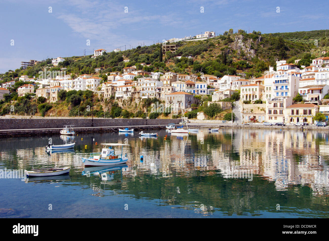 Pastel colored buildings on the waterfront and colorful fishing boats ...