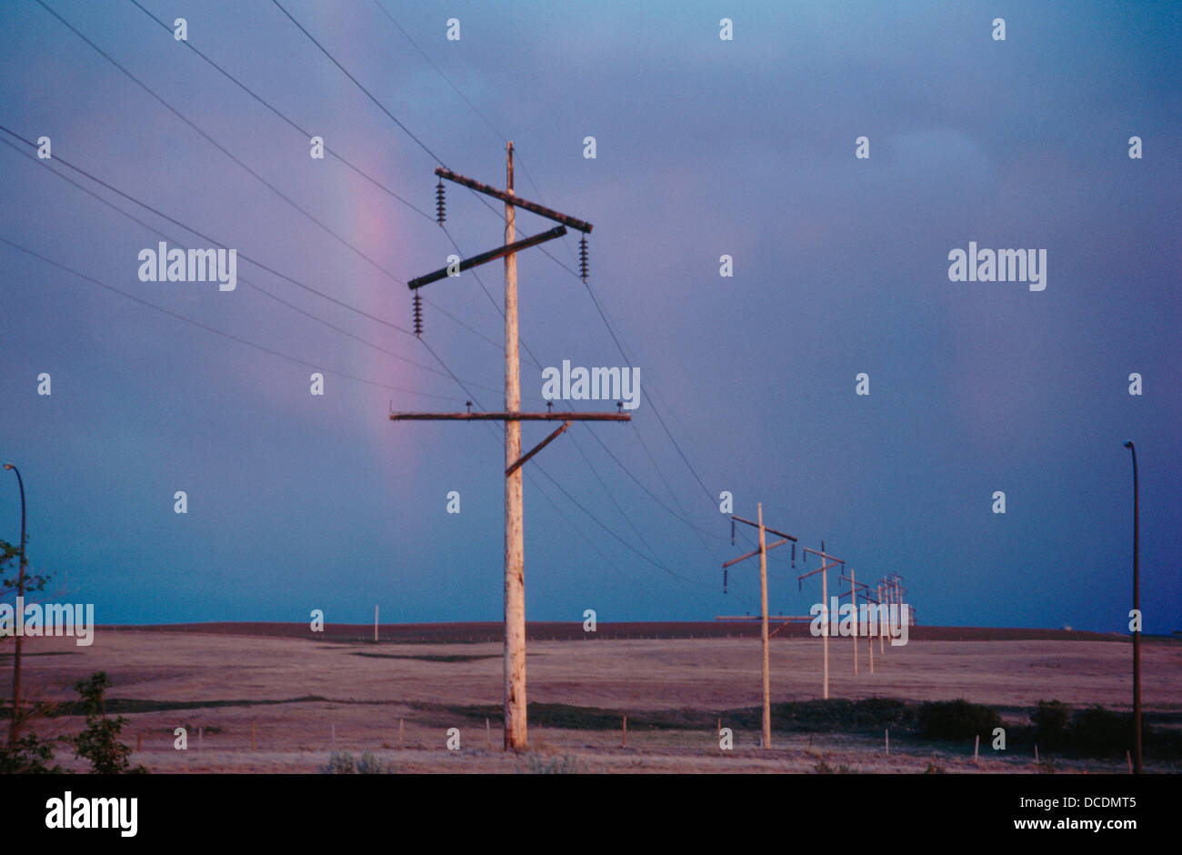 Power lines with rainbow. Southern Alberta. Canada Stock Photo - Alamy
