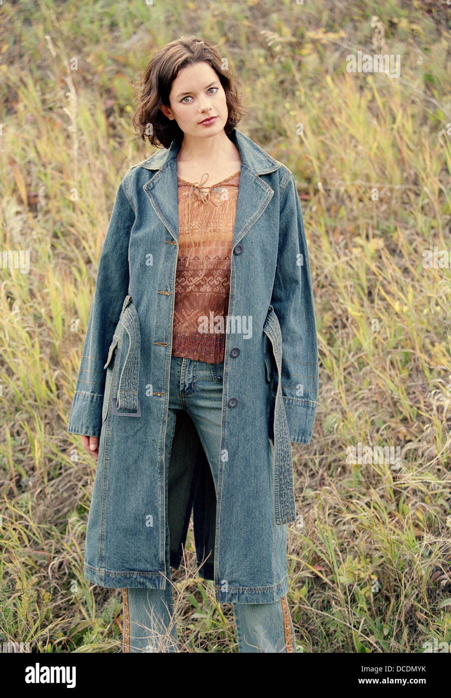 Young Woman Standing Outside In Field Stock Photo - Alamy