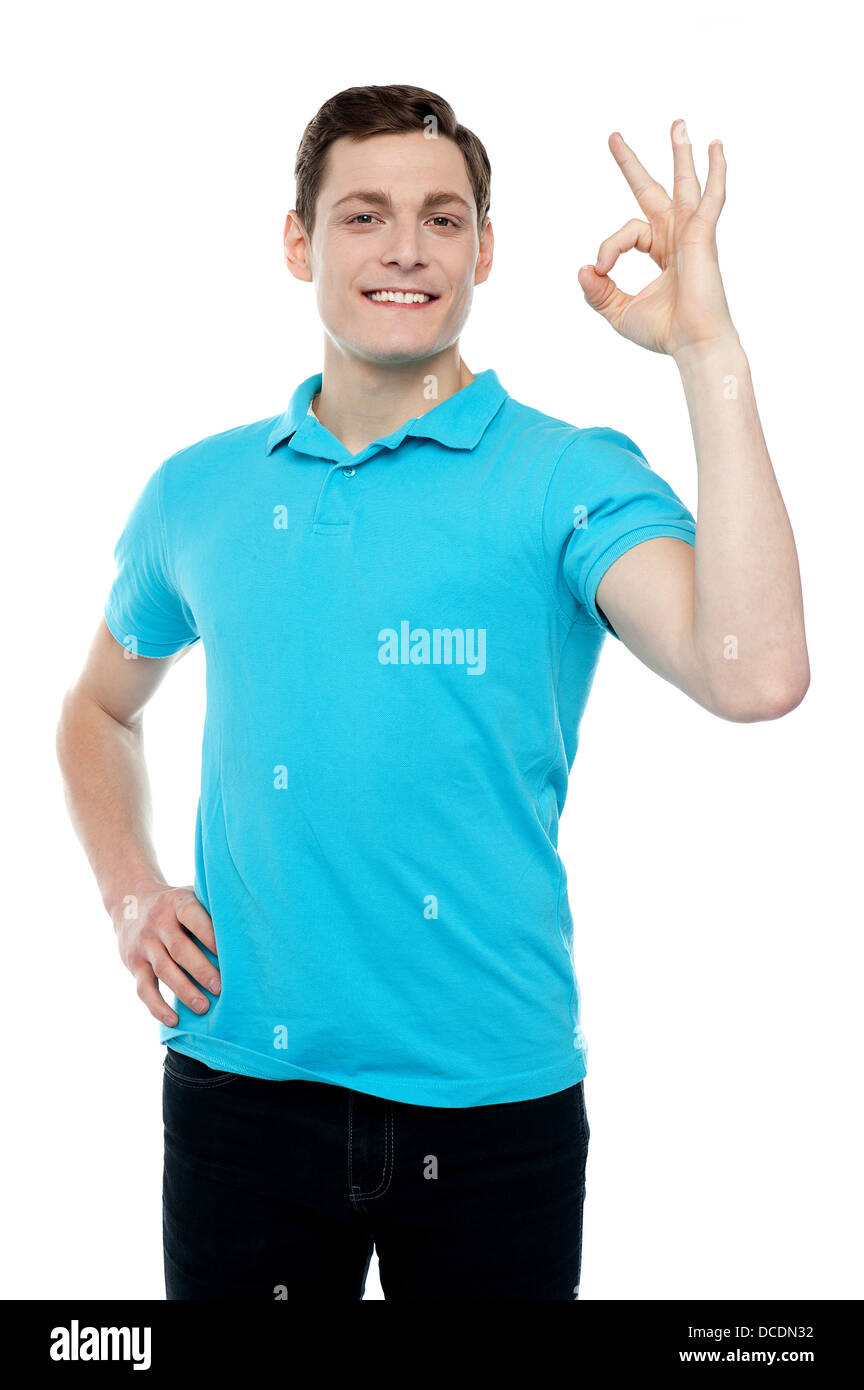 Smiling cool guy with an excellent gesture isolated against white ...