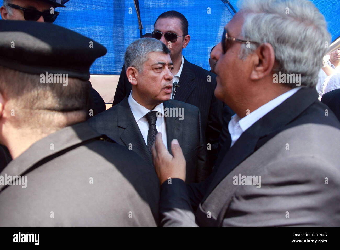 Cairo, Egypt. 15th Aug, 2013. Egyptian policemen attend the funeral of ...