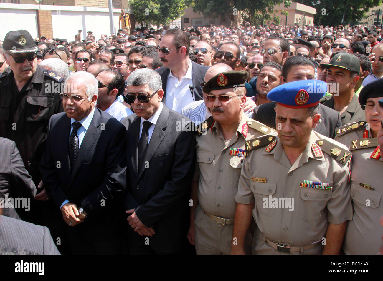 Cairo, Egypt. 15th Aug, 2013. Egyptian policemen attend the funeral of ...